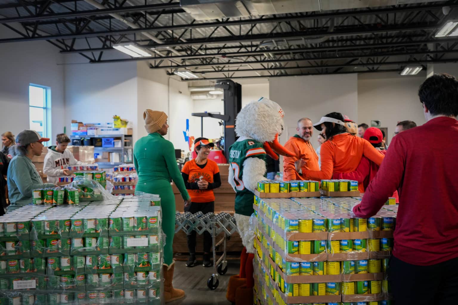 Miami and Ohio State Universities Pack 21,800 Meals Ahead of Cotton Bowl